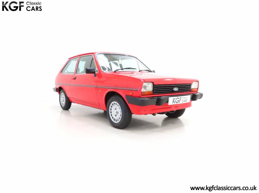 A Luxurious Mk1 Ford Fiesta 1300 Ghia , Sunburst Red, £ 10,995
